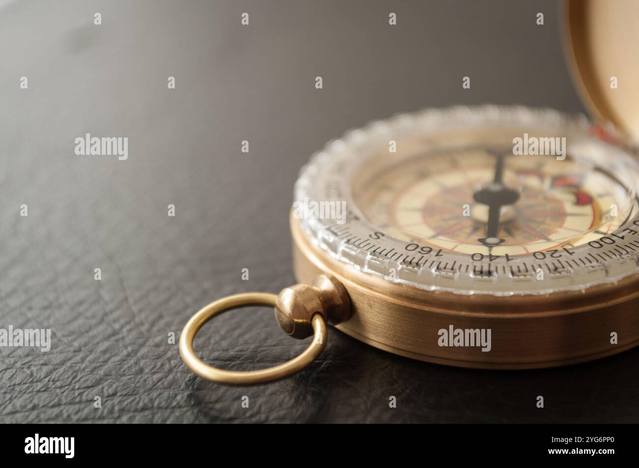vintage plated compass Stock Photo - Alamy