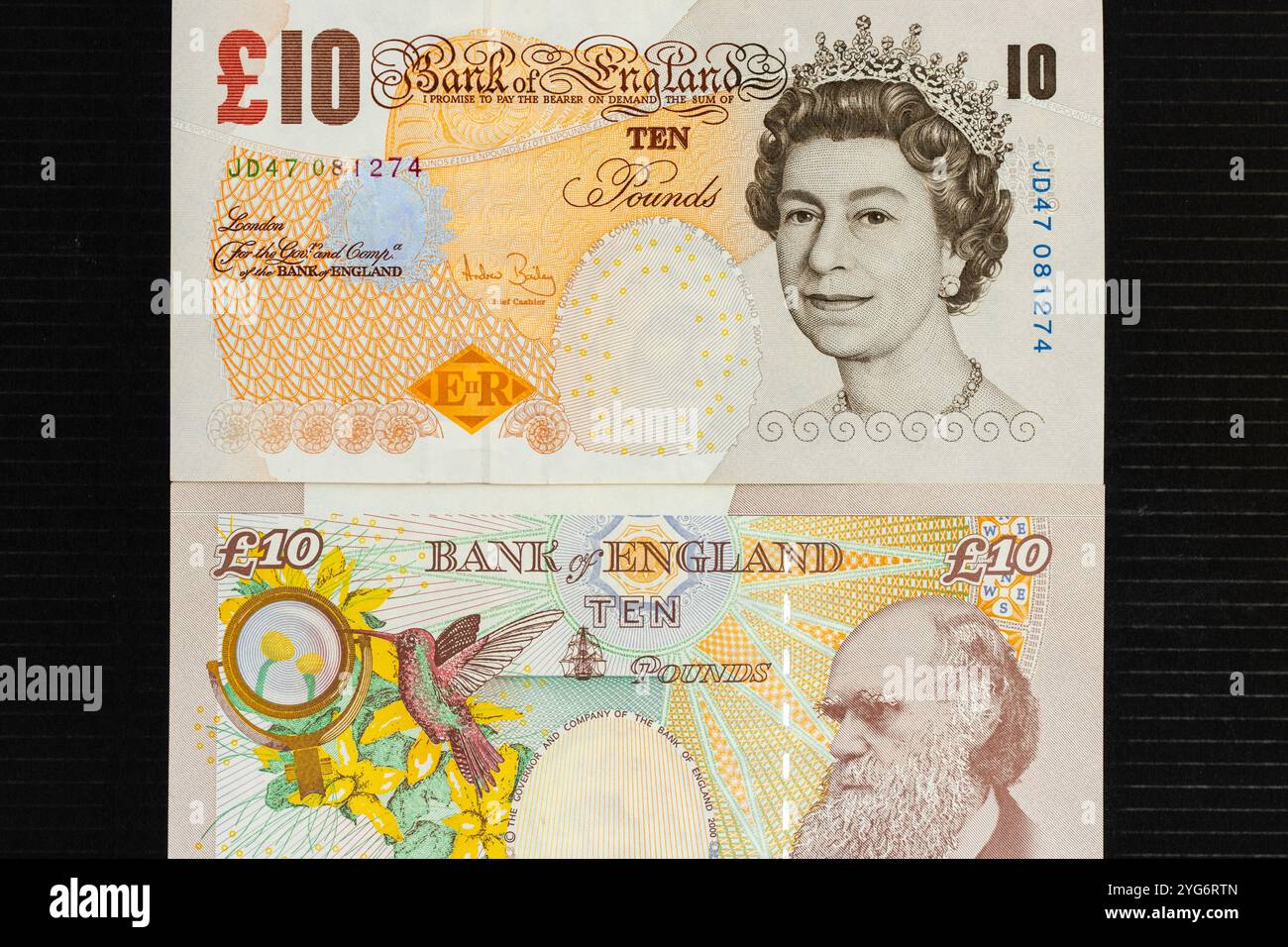 British 10 pounds sterling bank note both front and back sides on black ...