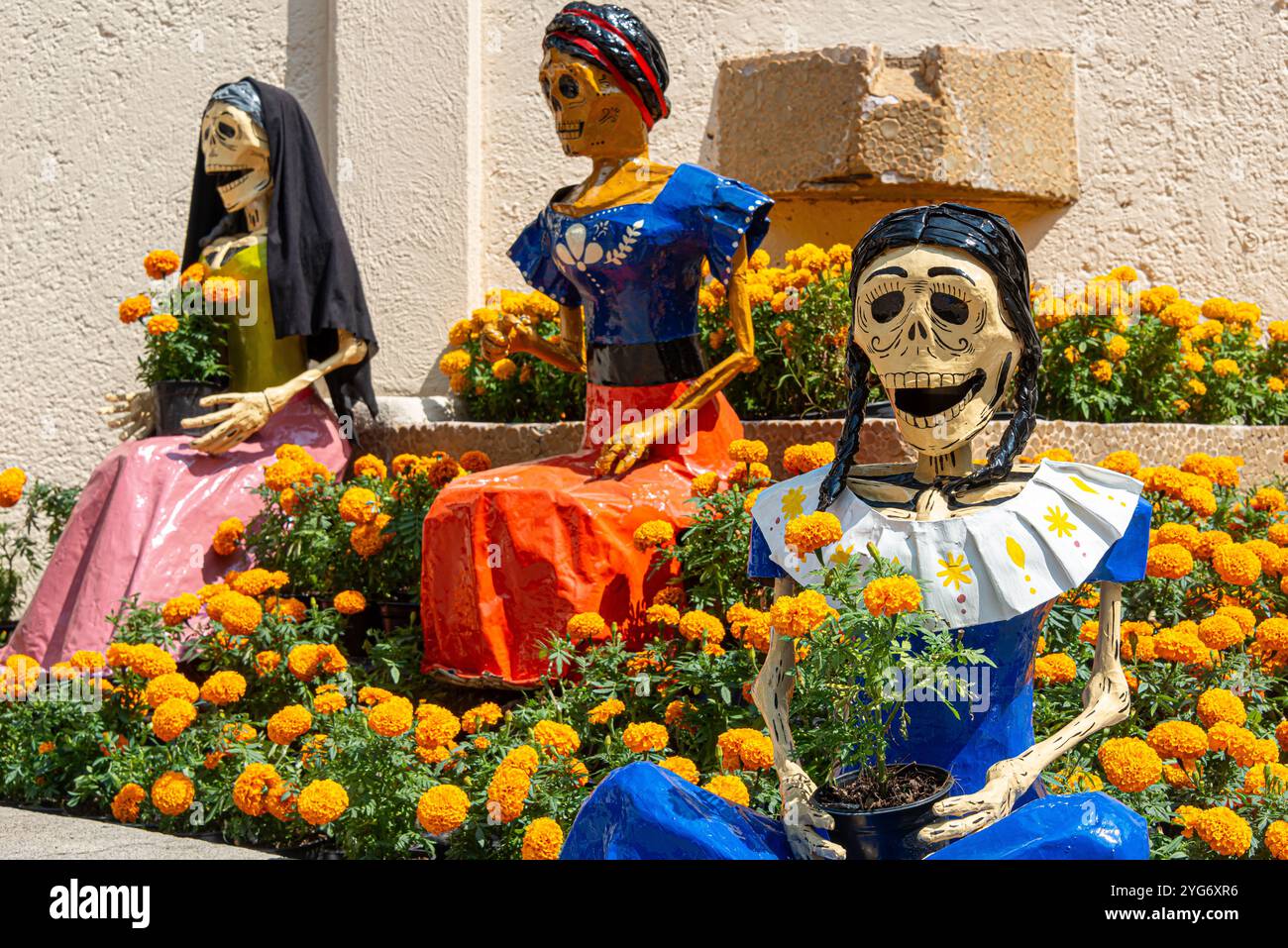Handcrafted Mexican catrinas made from papier-mâché and adorned with ...