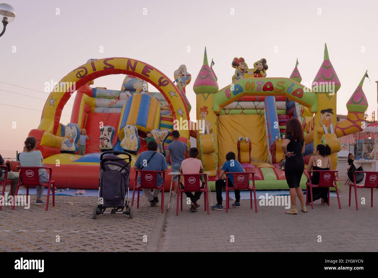 Colorful inflatable playground featuring cartoon characters ...