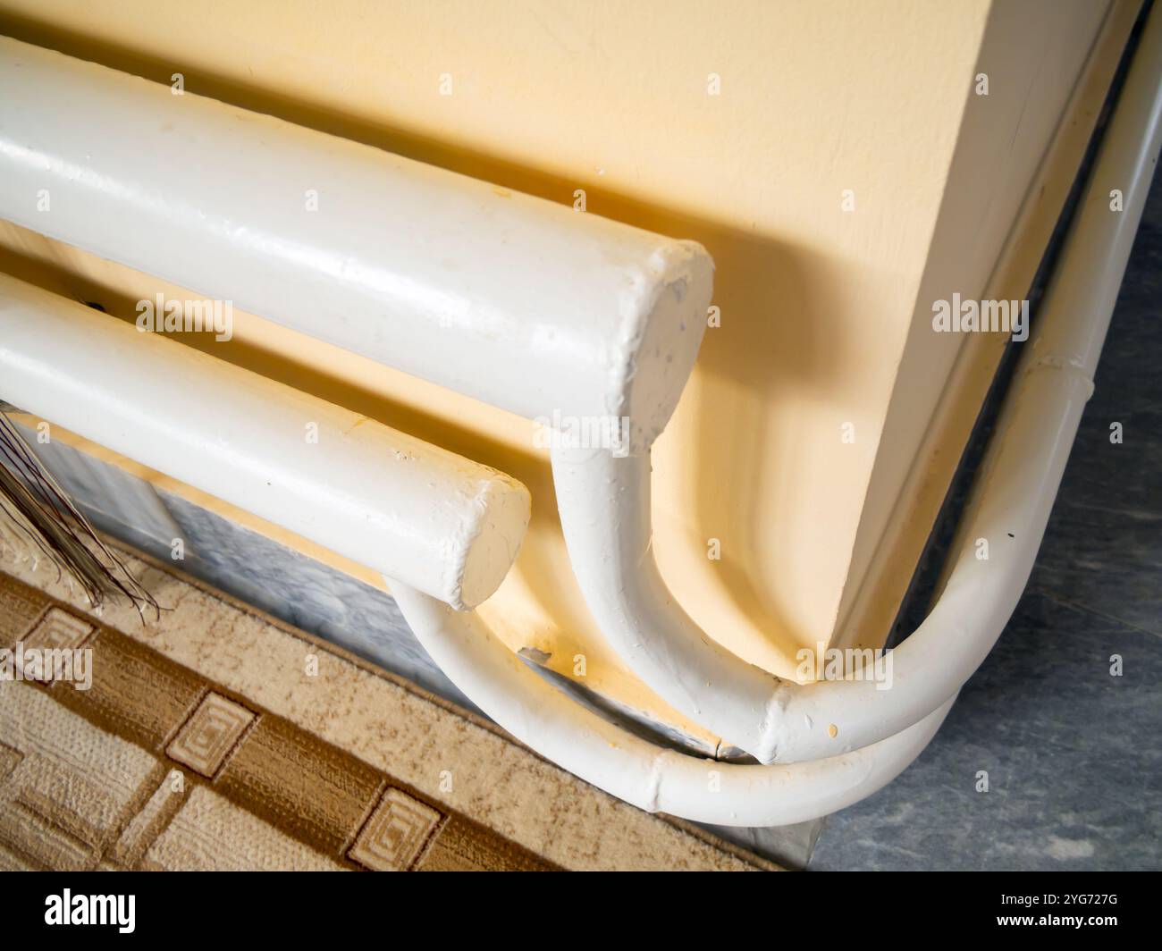 Welded heating register from metal water pipes Stock Photo - Alamy