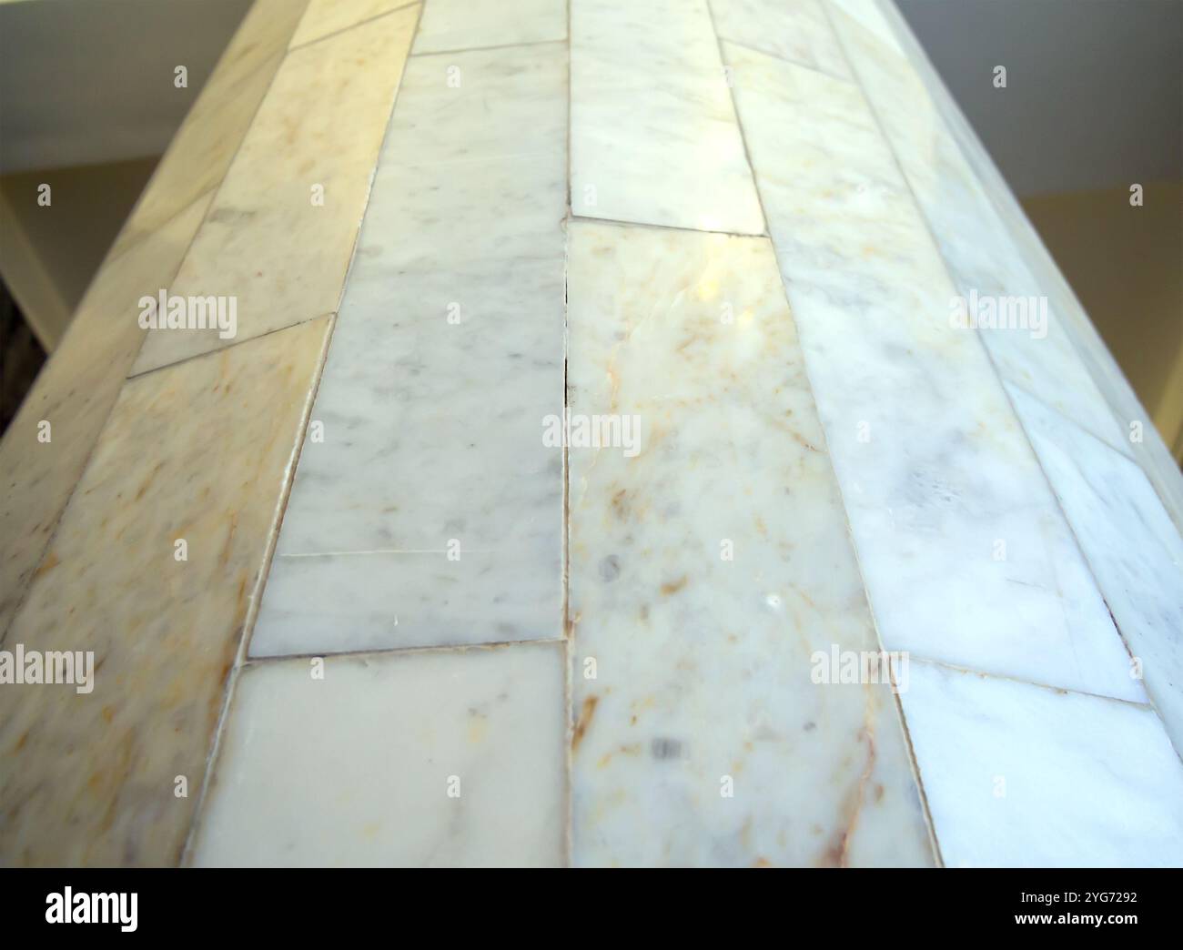 Fragment of a column decorated with marble tiles Stock Photo - Alamy