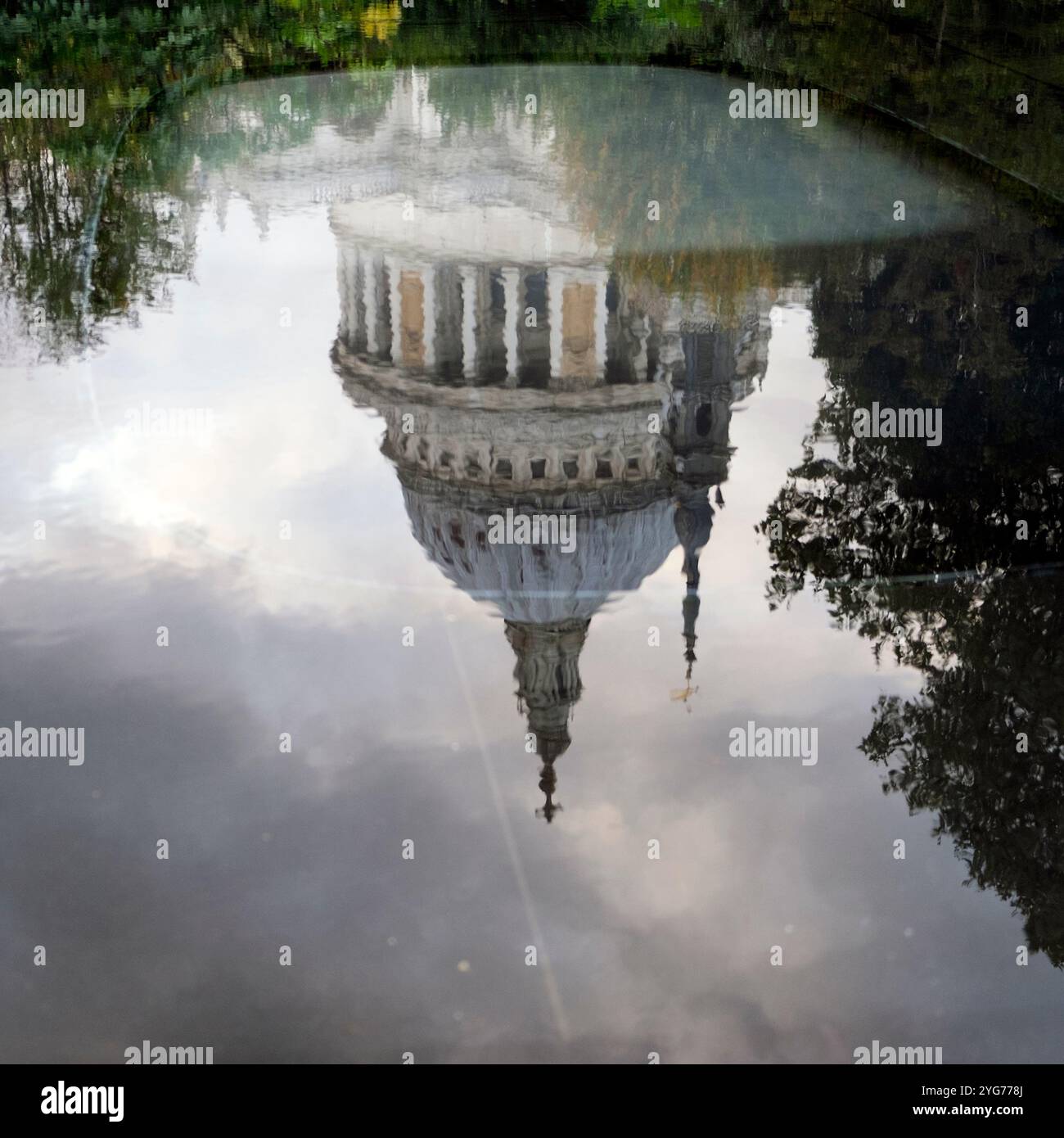 Reflection of St Pauls Cathedral dome in garden pond London England UK ...