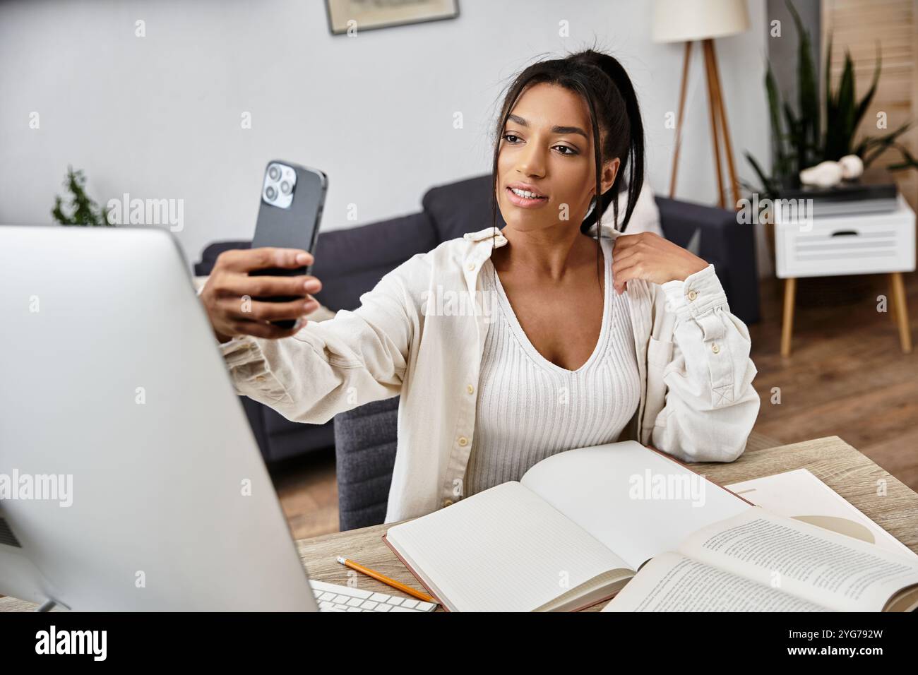 The young woman engages in her remote studies, sharing her learning journey online Stock Photo ...