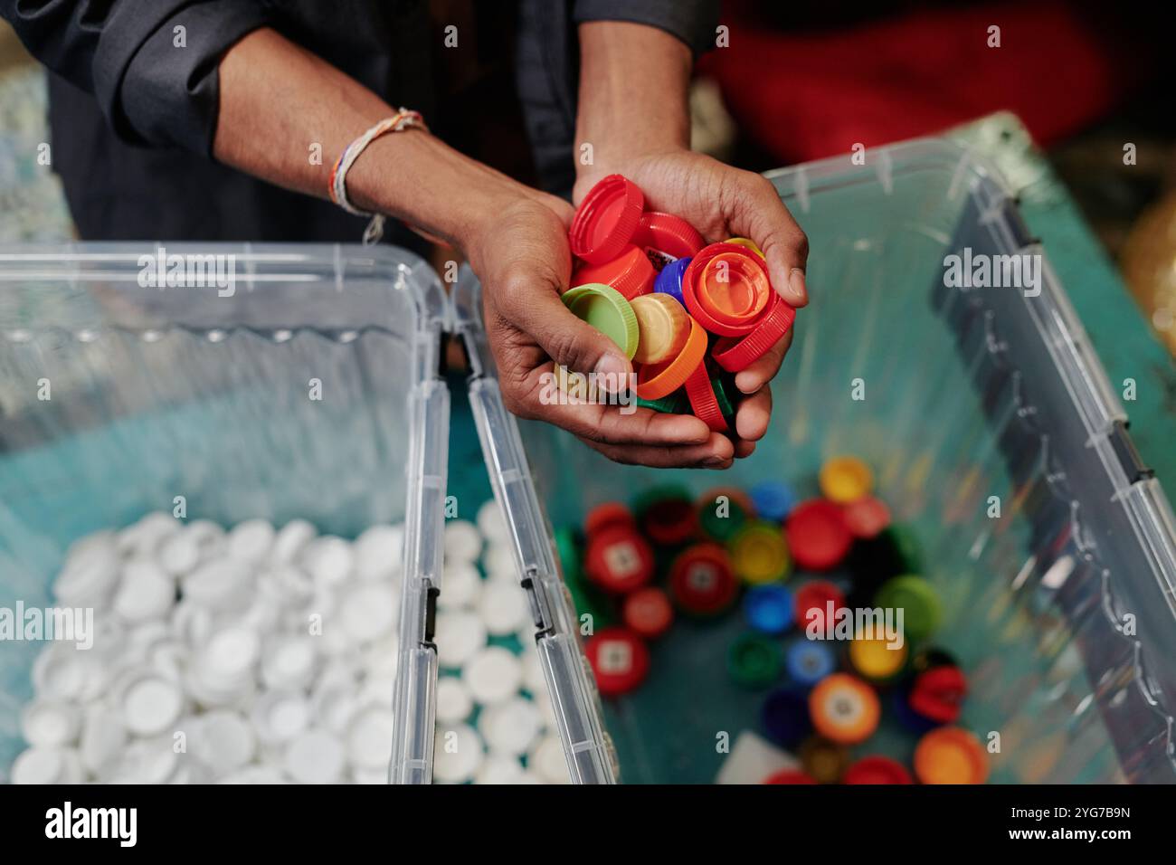 Unrecognizable young male worker of plastic recycling factory or ...
