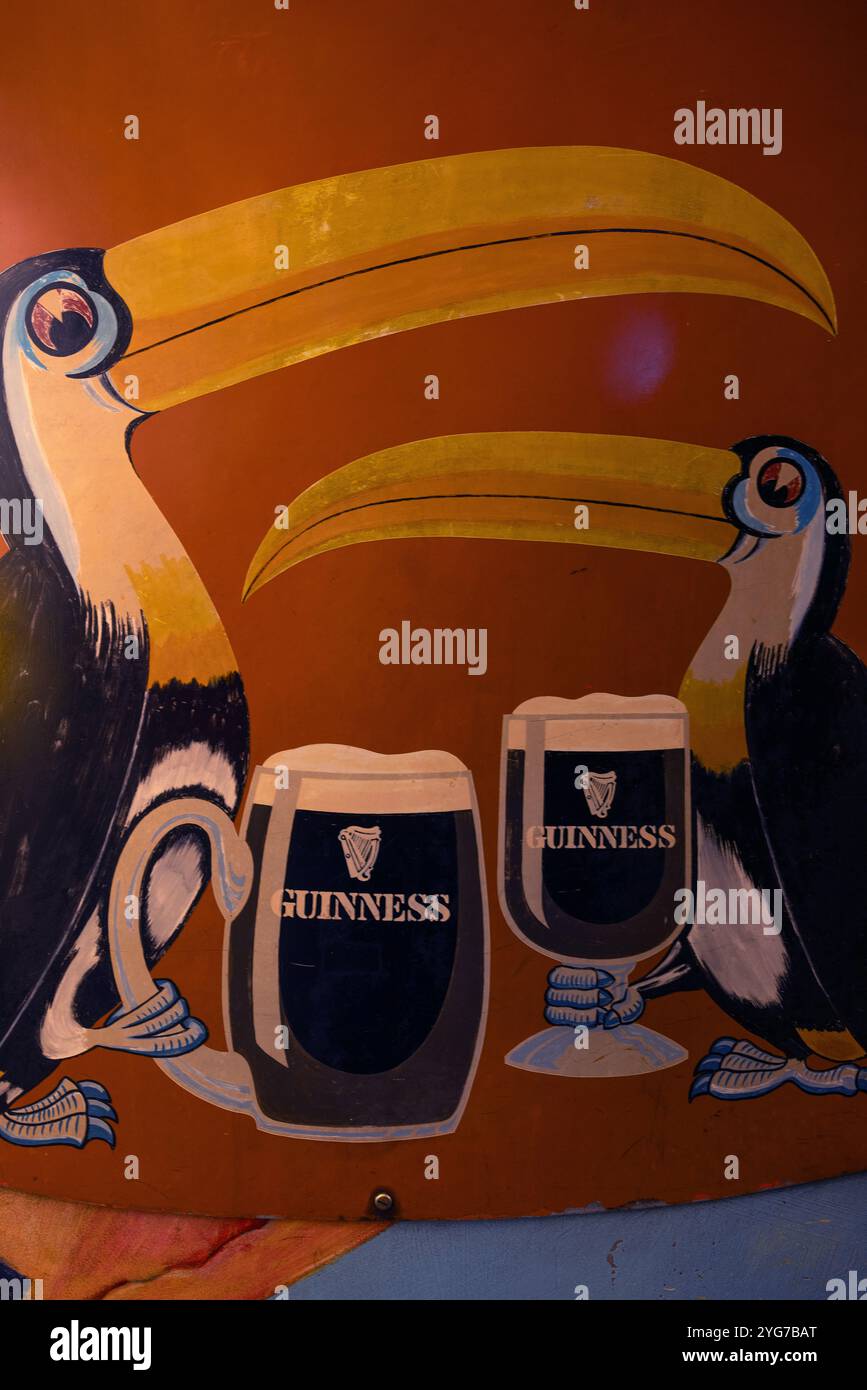 Retro Guinness beer sign with toucan Stock Photo - Alamy