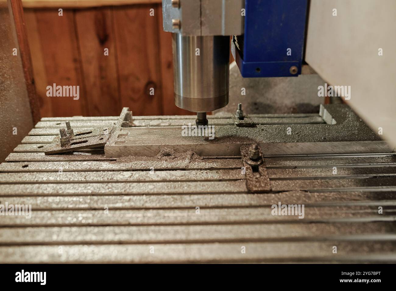 Industrial metalwork machine drilling holes in detail of processing ...