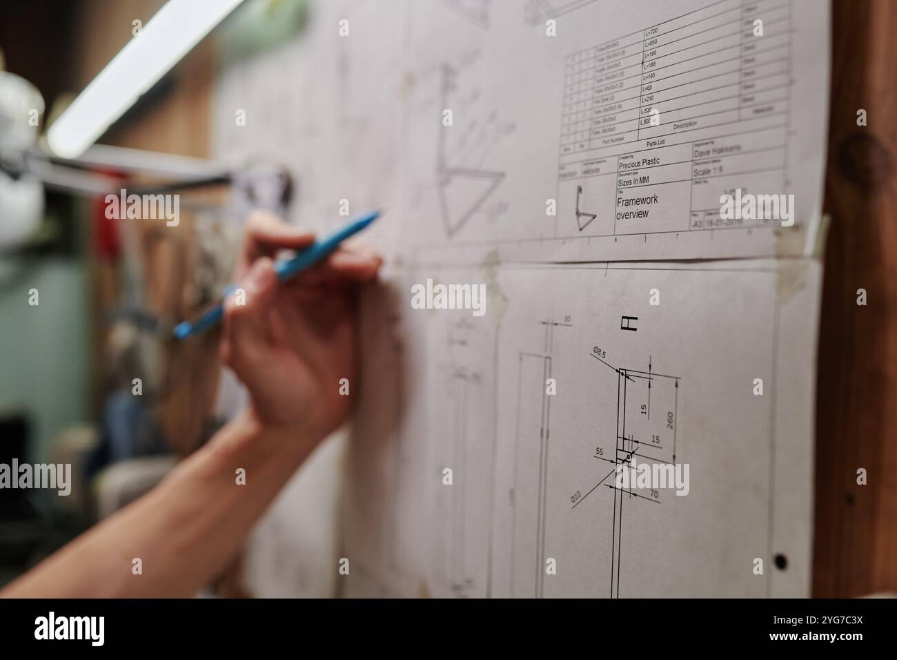 Focus on part of technical drawings with sketches and tables of ...