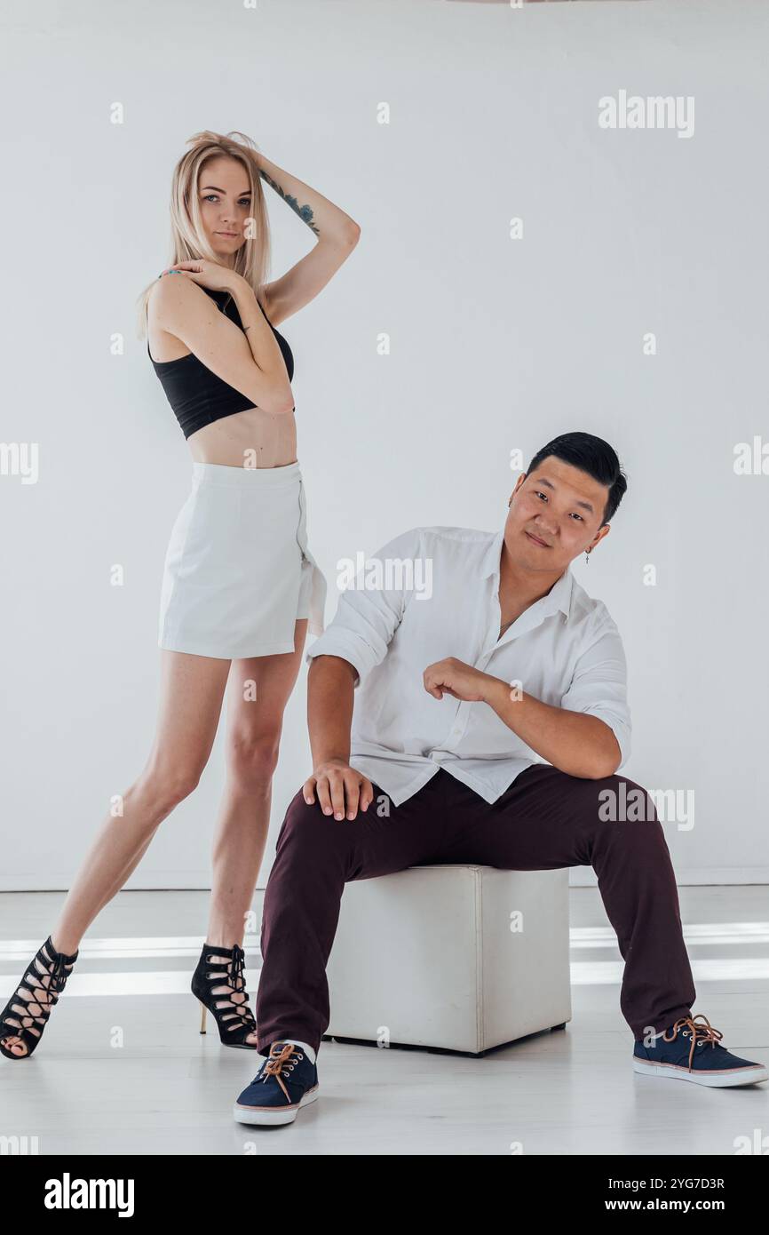 Man And Woman Sitting Together Side By Side Hugging And Smiling Stock ...