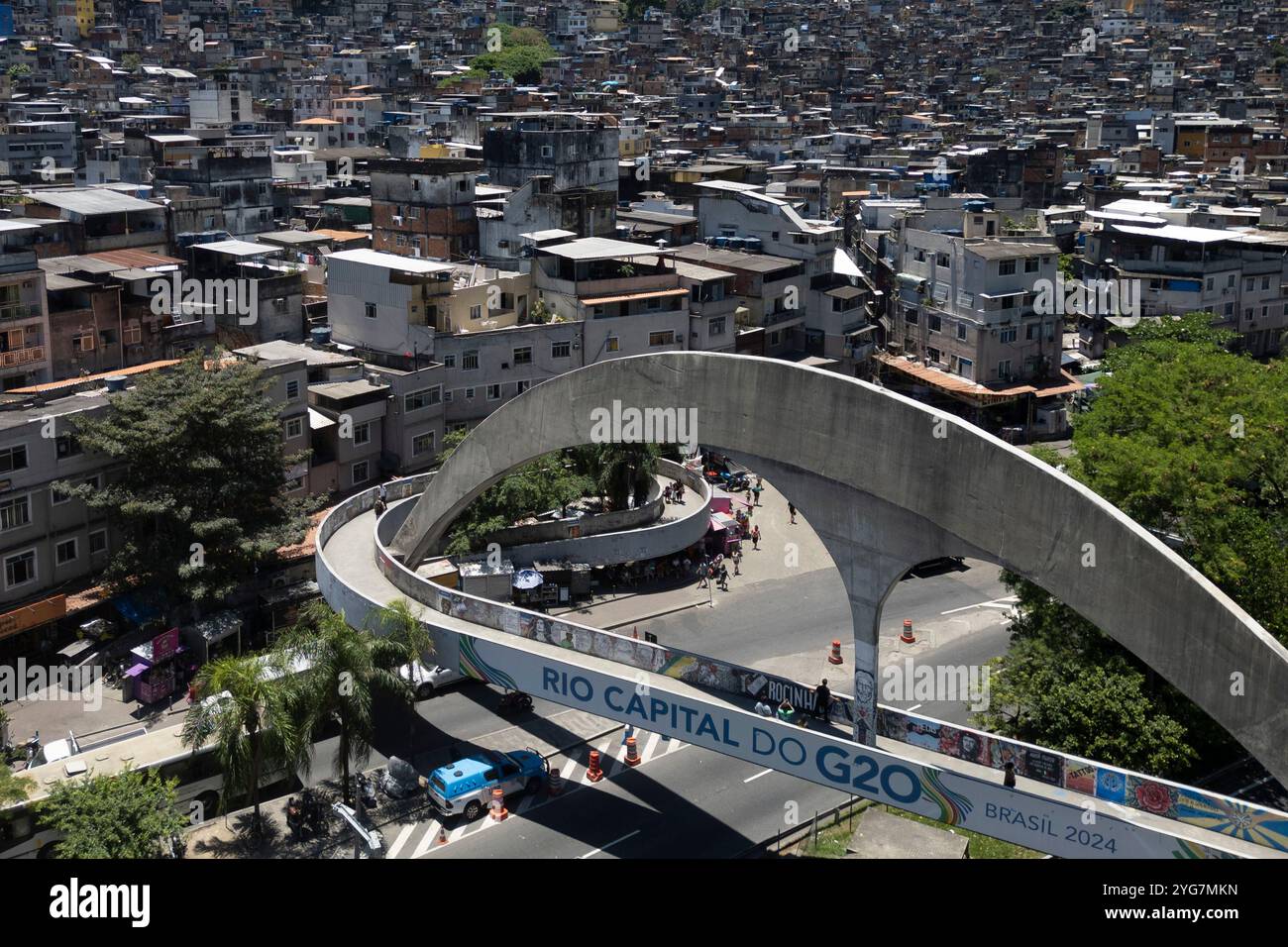 A pedestrian bridge leading to the Rocinha favela is covered by a sign ...