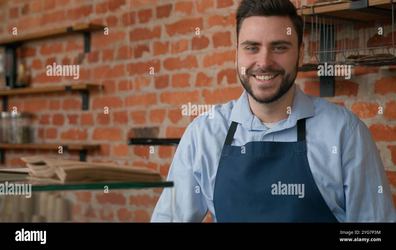 Smiling caucasian man waiter professional barista bartender make coffee ...
