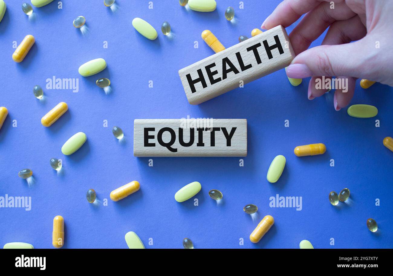 Health Equity symbol. Wooden blocks with words Health Equity. Beautiful ...