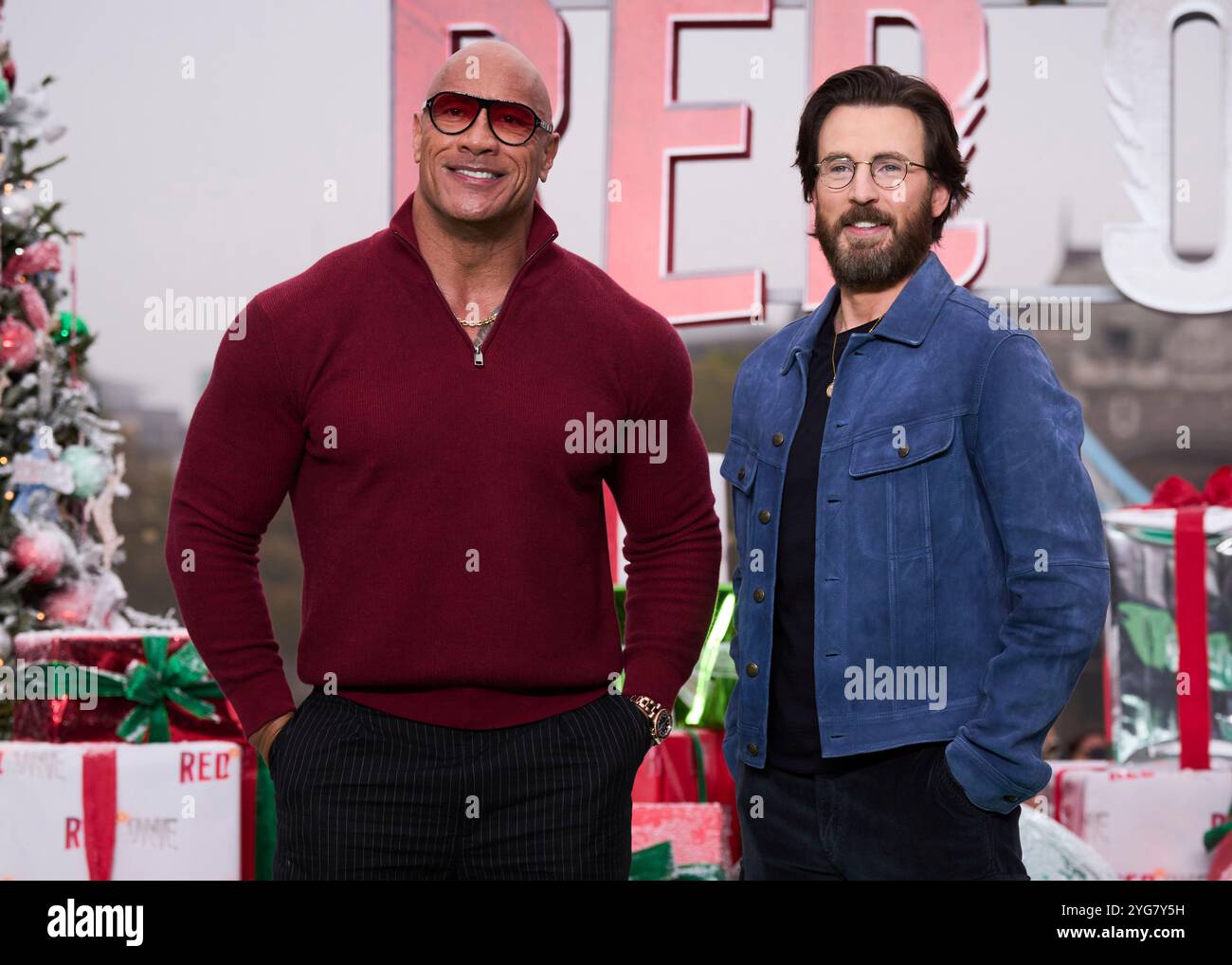 Dwayne Johnson, left, and Chris Evans pose for photographers upon ...