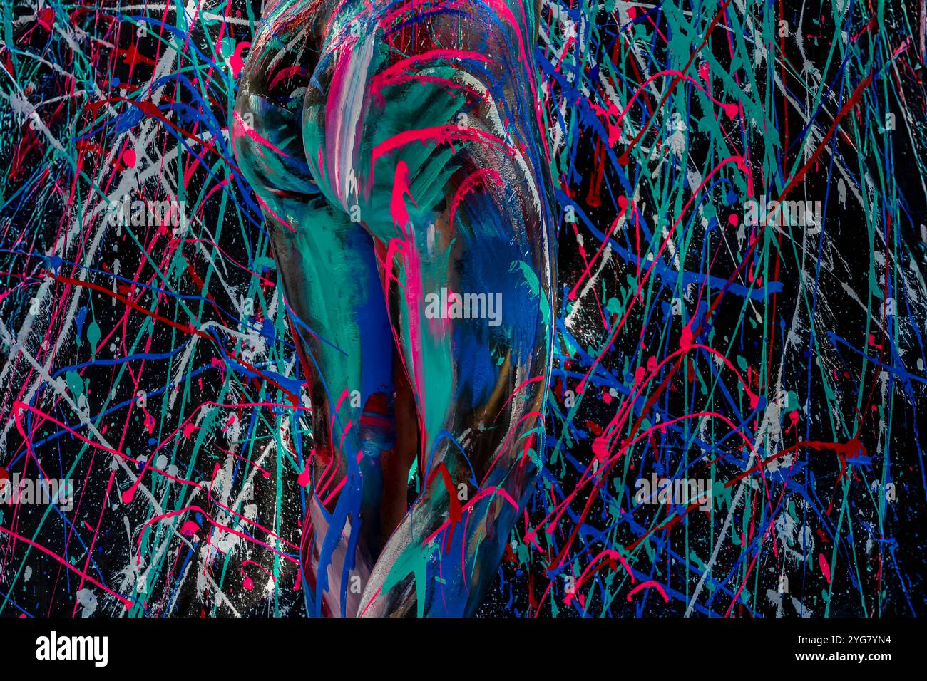 A model poses gracefully, her body adorned in vibrant body paint, with ...