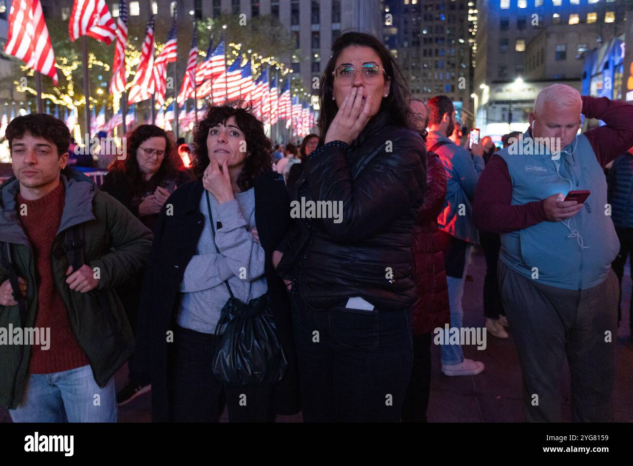 People gather in Rockefeller Center in New York City to watch the ...