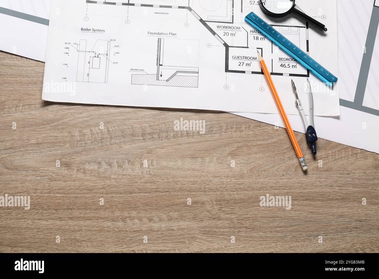 Different engineering drawings, pencil, dividers, ruler and magnifying ...