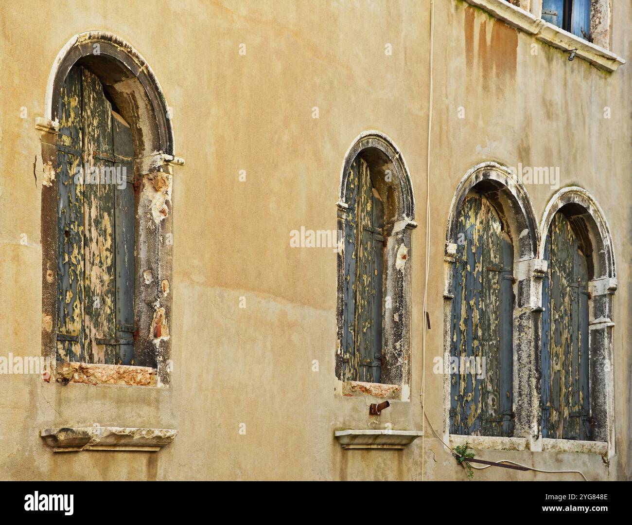 Old windows are covered with wooden shutters Stock Photo - Alamy
