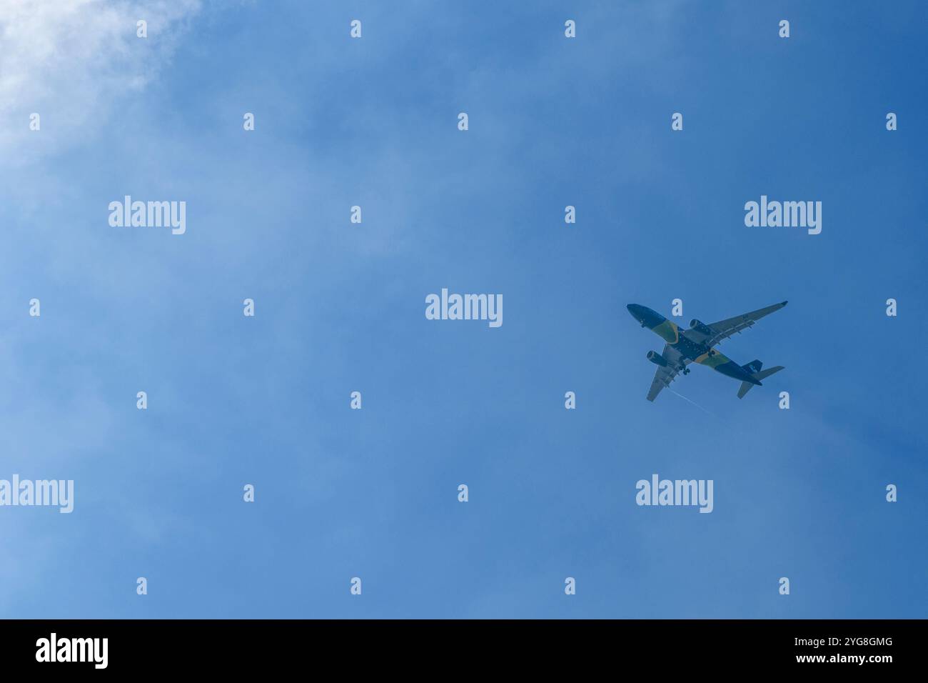 Plane with the Brazilian flag painted on it flying over the city of ...