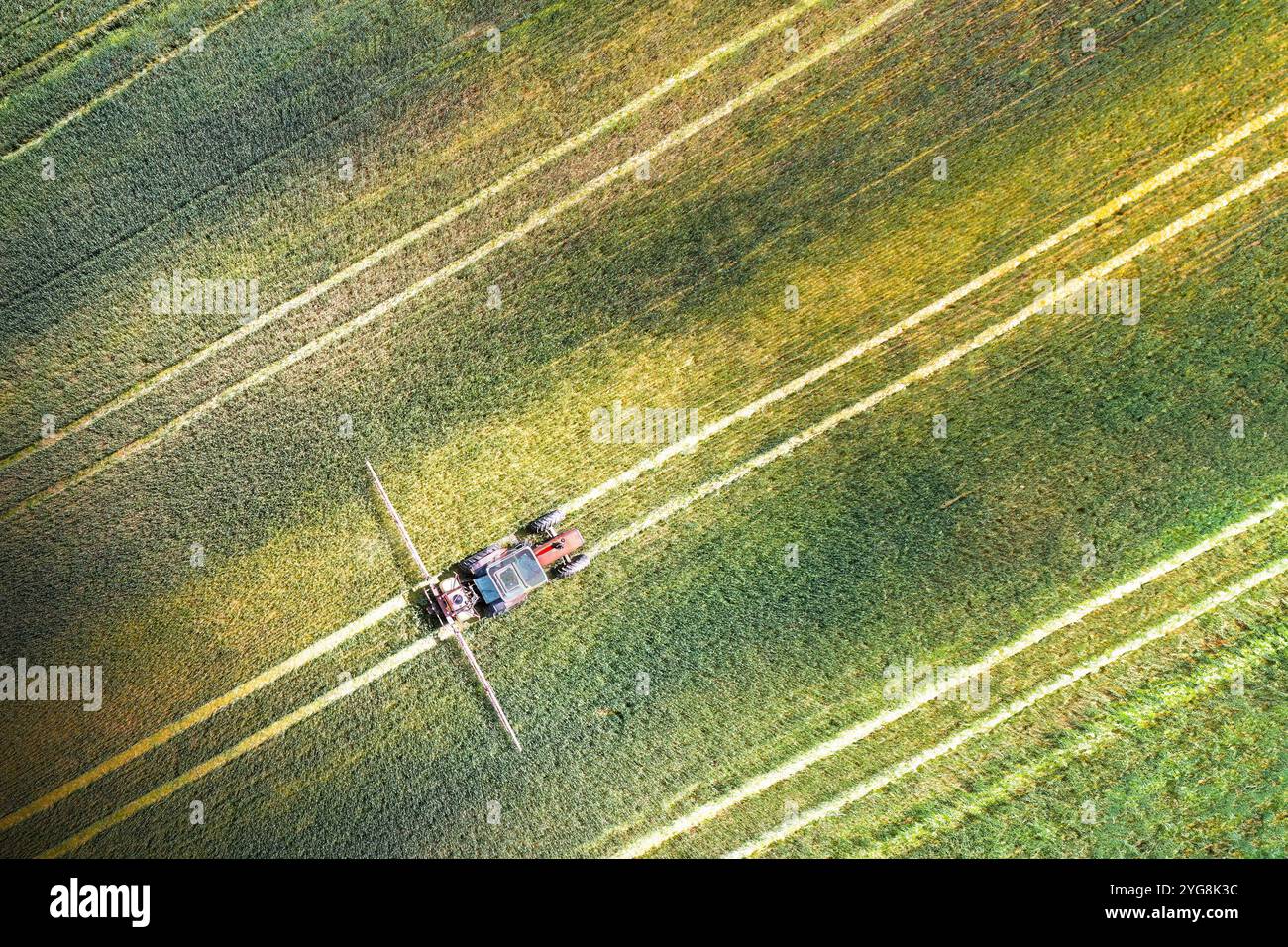 Tractor harvesting field in summer hi-res stock photography and images ...