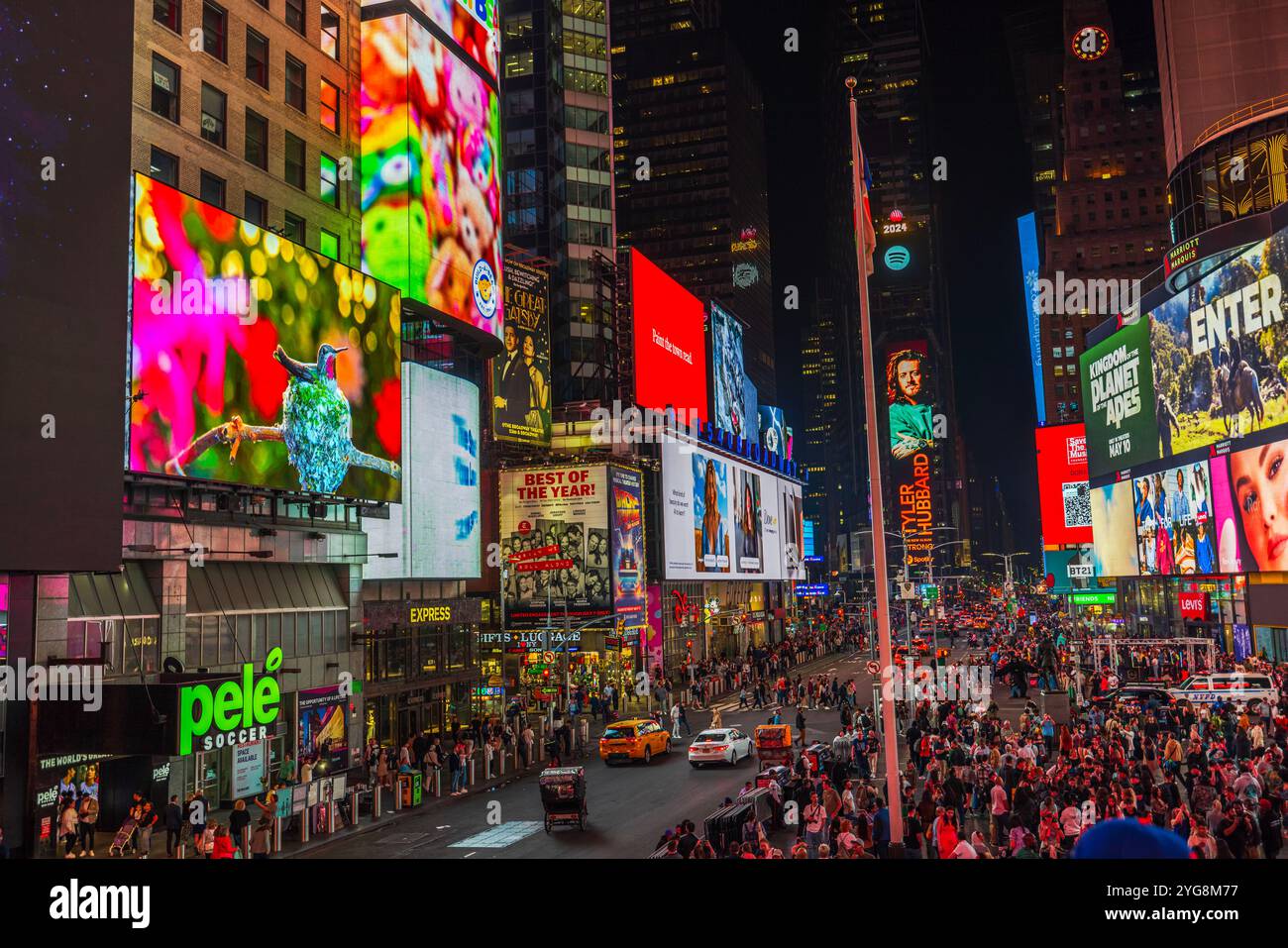 Times Square night scene with colorful billboards, bustling crowds, and ...