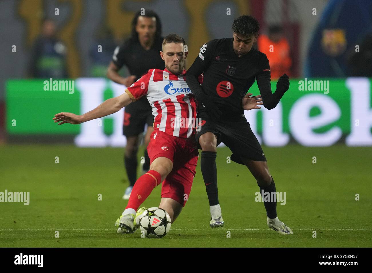 Red Star's Timi Max Elsnik, left, and Barcelona's Lamine Yamal fight ...