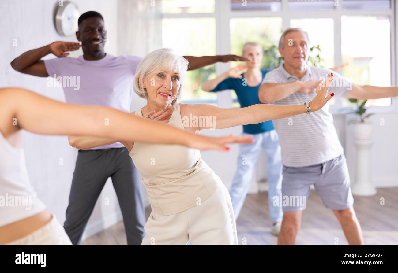 Elderly woman dancing hip hop during group dance class Stock Photo - Alamy