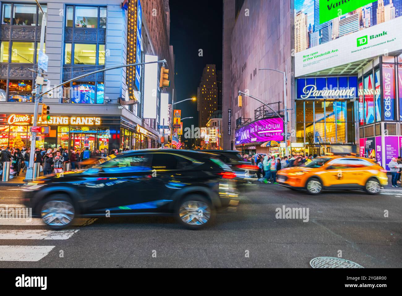 Times Square night scene with neon lights, Paramount building, and ...