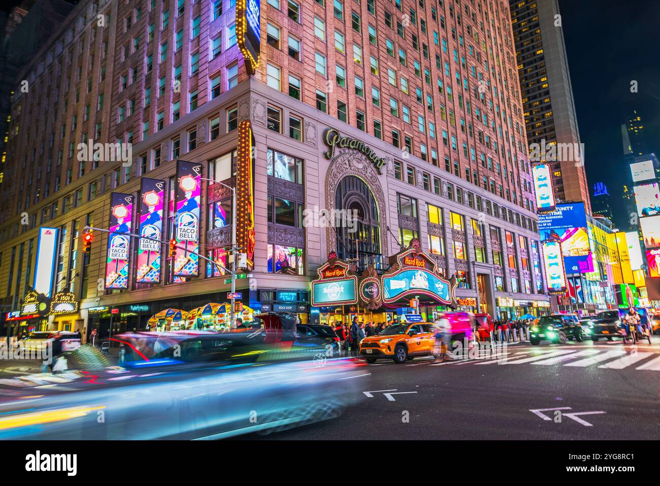 Times Square at night in New York City, with illuminated billboards and ...