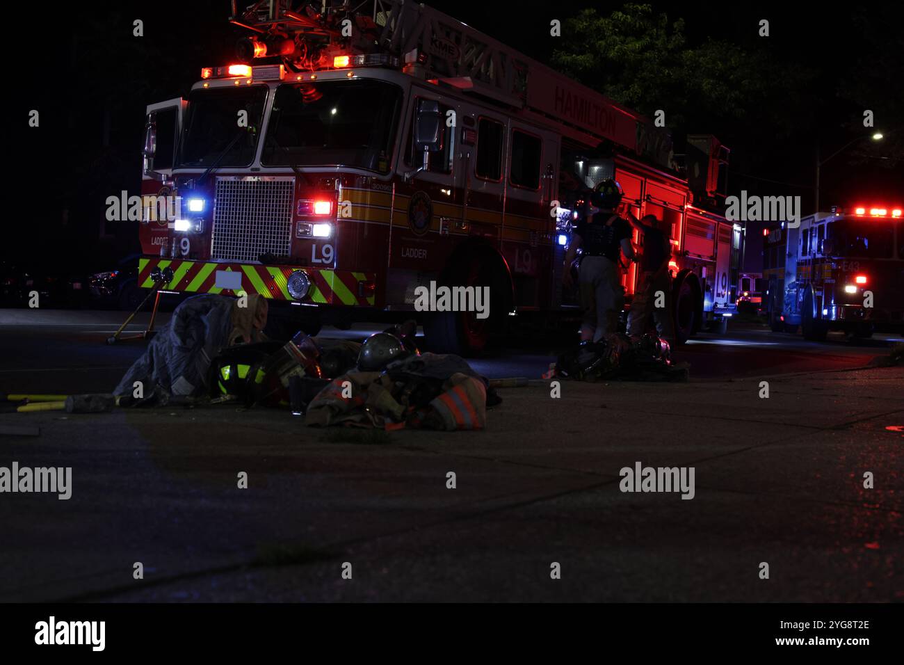Firetrucks flashing lights at night Stock Photo - Alamy