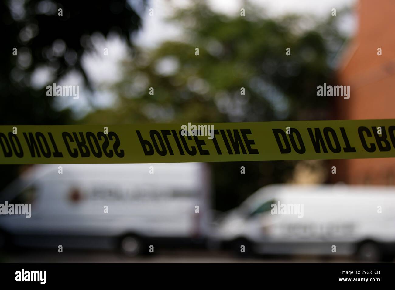Forensic police at crime scene police tape Stock Photo - Alamy