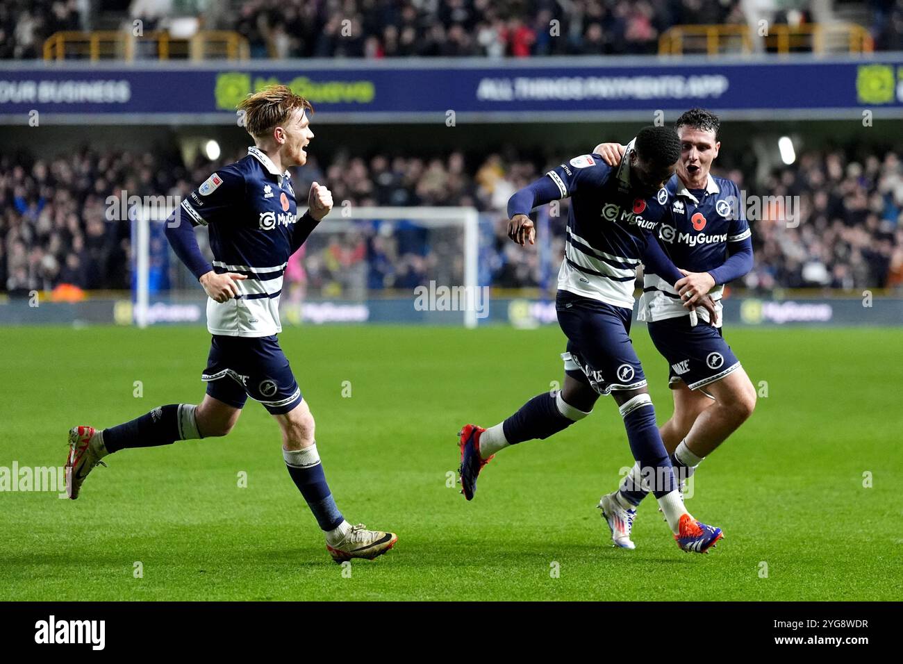 Millwall's Japhet Tanganga (centre) celebrates scoring their side's ...