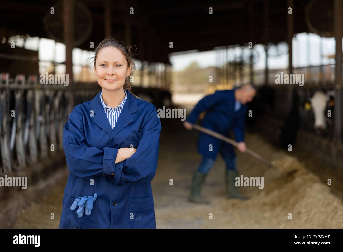 Portrait of confident woman cow farm worker Stock Photo - Alamy