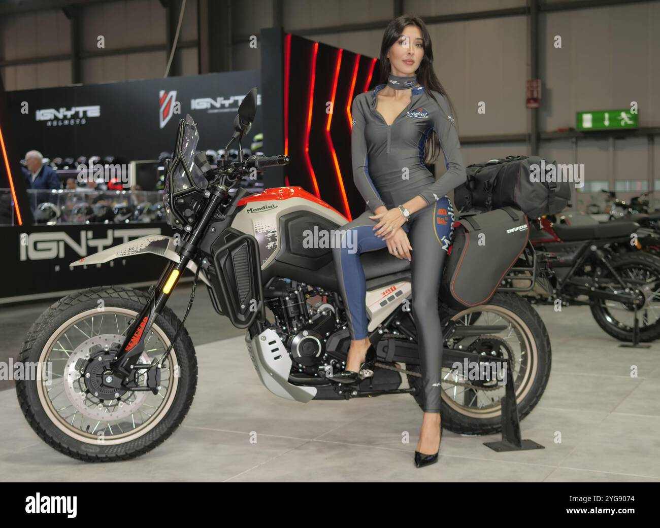 Models on motorbikes at EICMA, international motorcycle exhibition on ...
