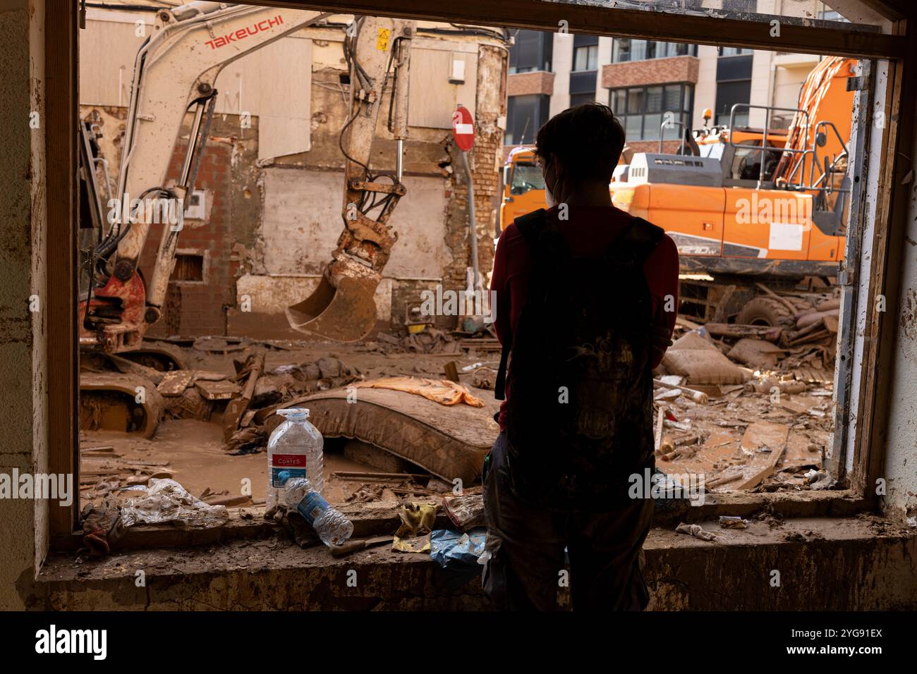 Paiporta, Valencia, Spain. 5th Nov, 2024. A man looks out the window at ...