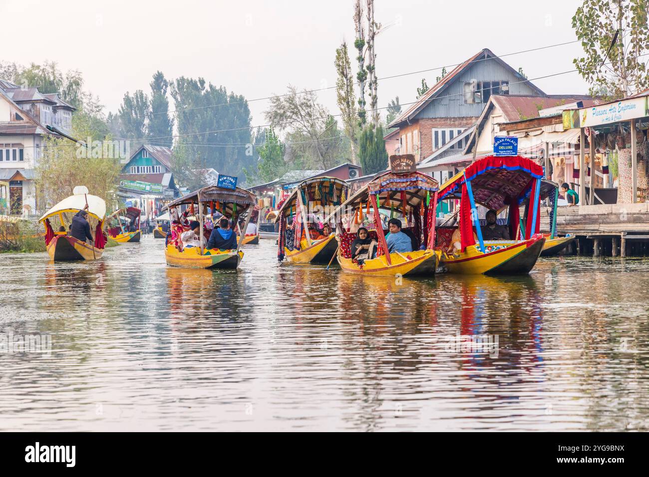 Rainawari, Srinagar, Jammu and Kashmir, India. Tourists in traditional ...