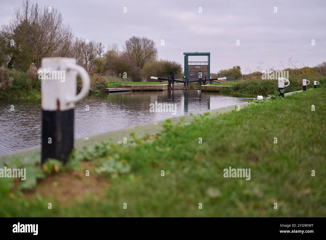 sluice gate and lock in river with blurred mooring bollard in ...