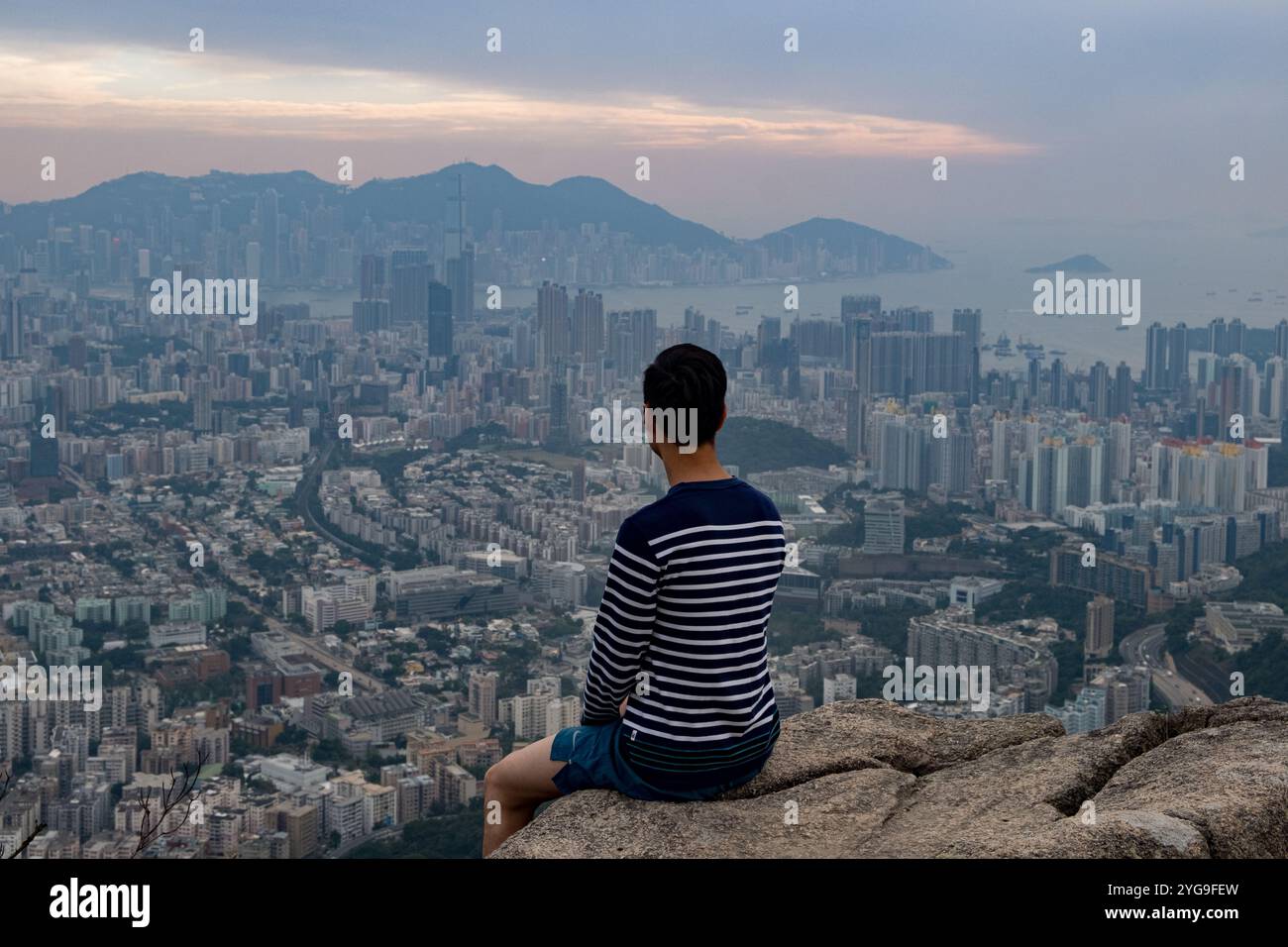 A person observes the concrete jungle of Kowloon, Hong Kong Stock Photo ...