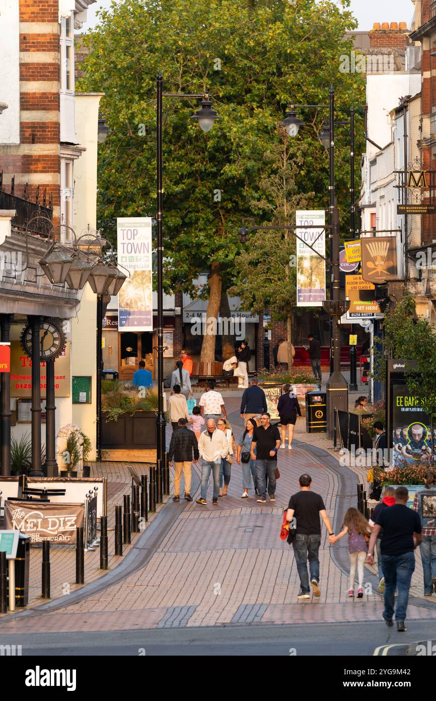 Shoppers walking on the pedestrianised Winchester Street (also known as ...