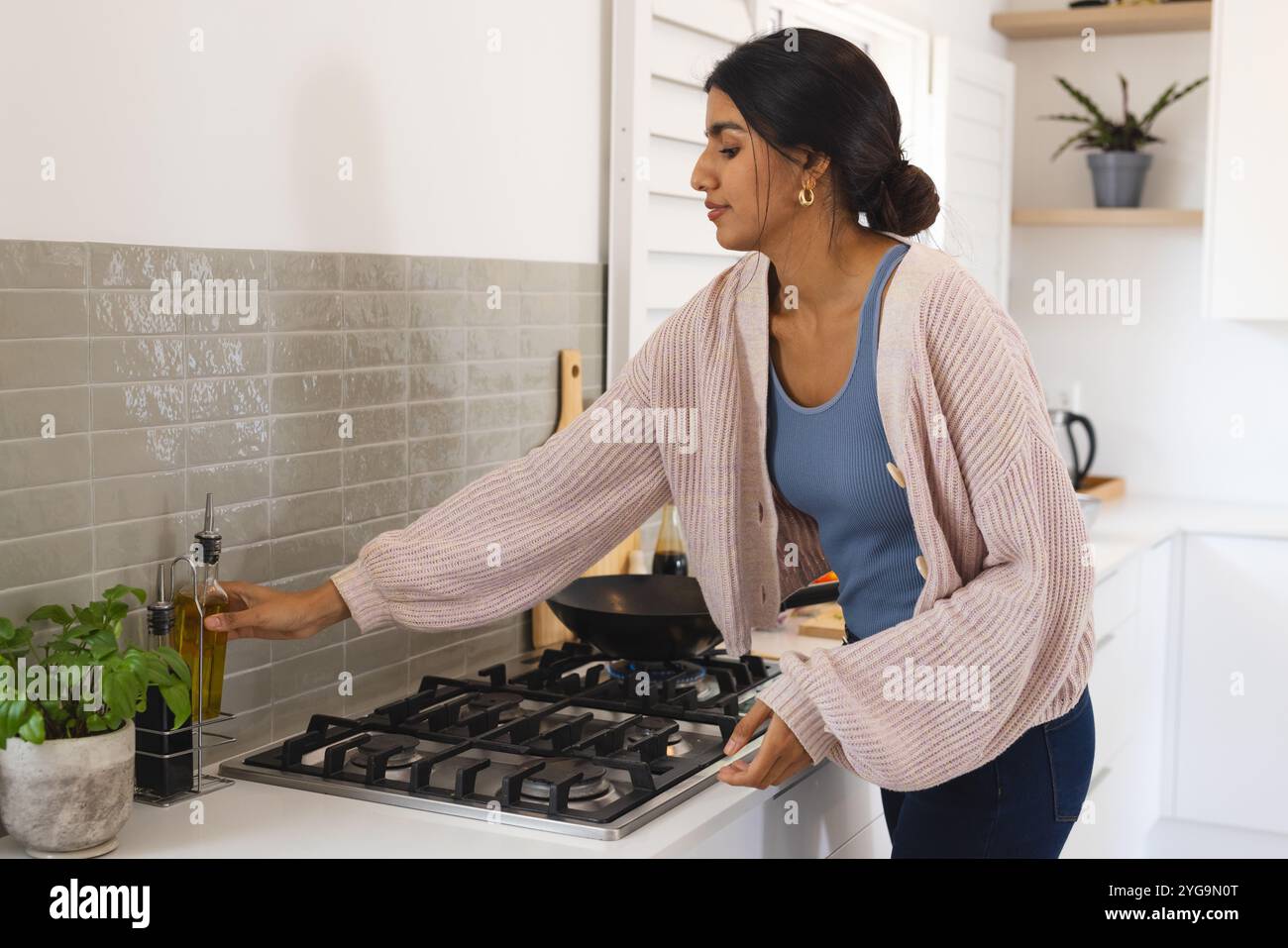 Cooking in modern kitchen hi-res stock photography and images - Alamy