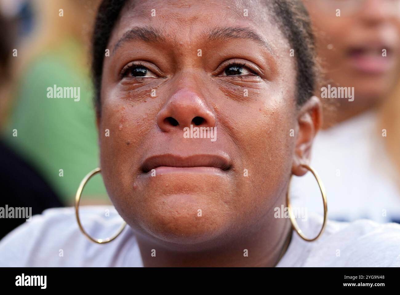 A supporter cries as Vice President Kamala Harris delivers a concession ...