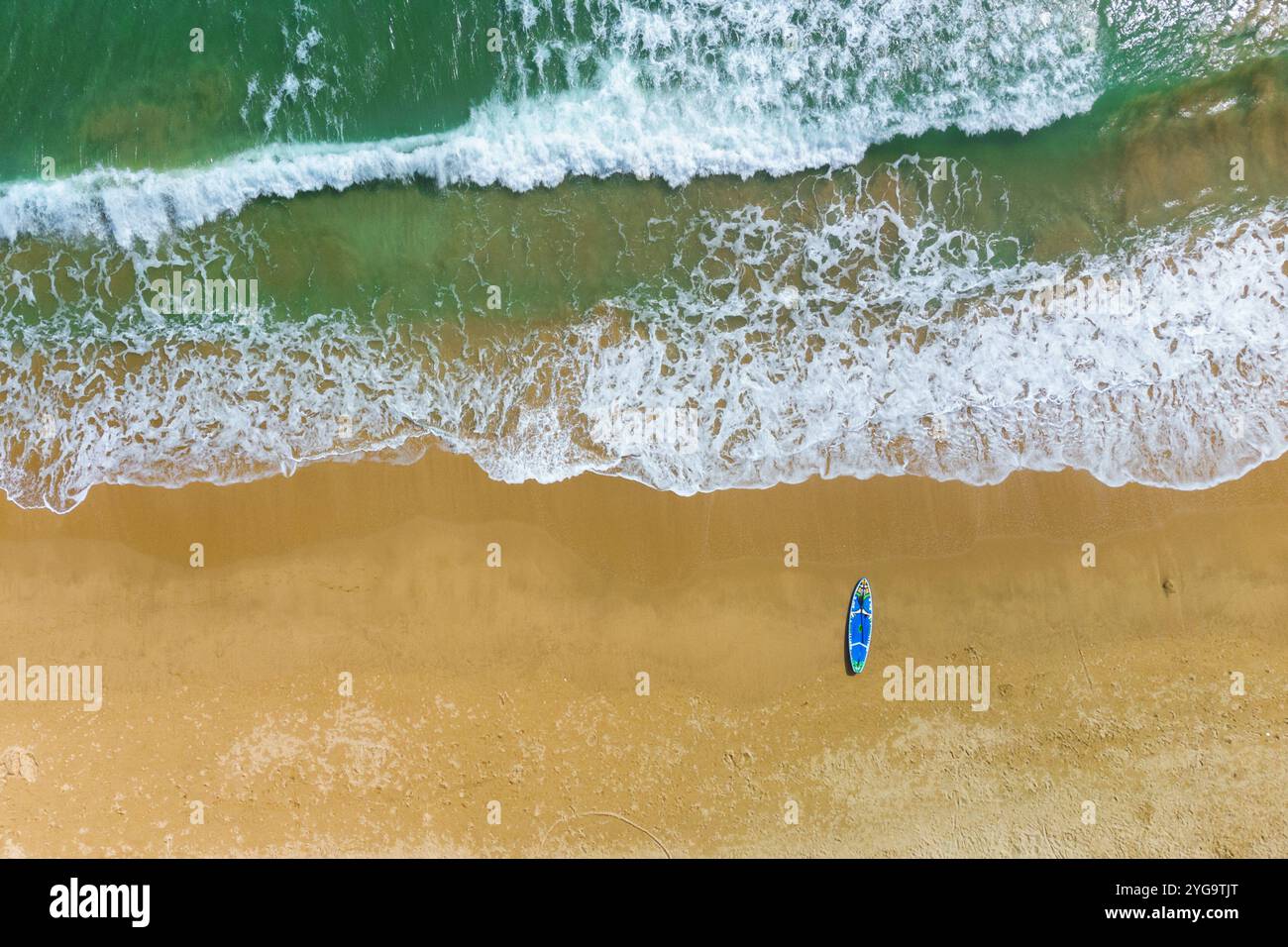Awesome aerial view of sand beach and white crested waves Stock Photo ...