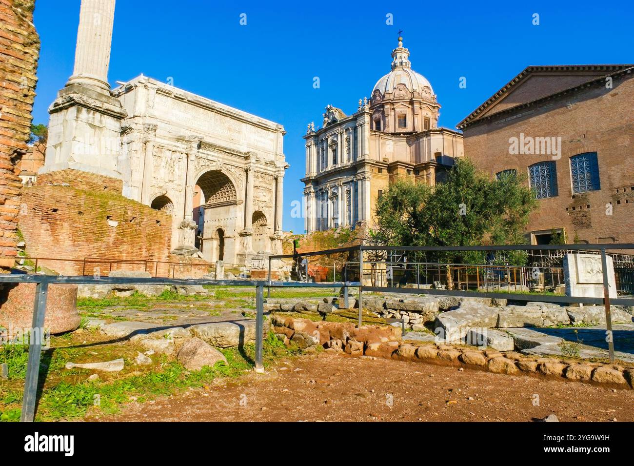 The Roman Forum with ruins of ancient temples, arches and buildings ...