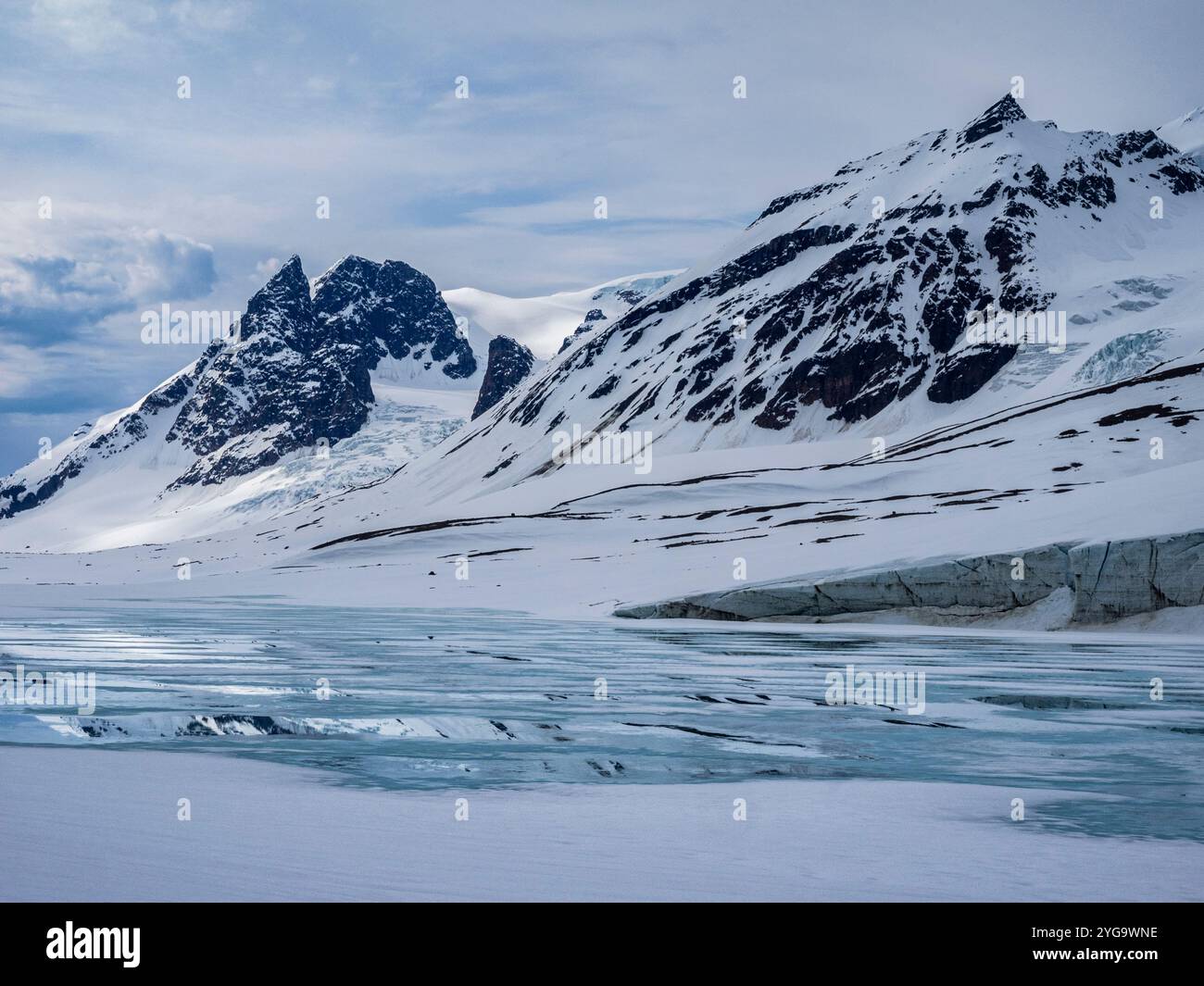 Svalbard, Norway. Landscape of mountain, glacier and water Stock Photo ...