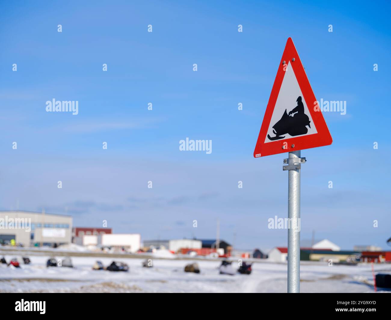 Snowmobiles, traffic sign. Longyearbyen, the capital of Svalbard on the ...