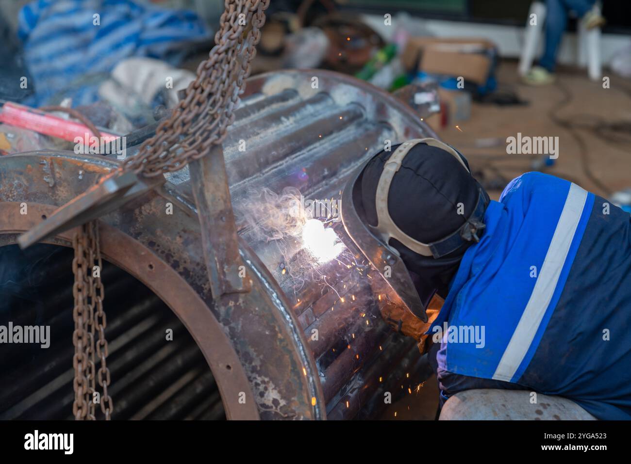 A Welder Works On Welding between pipes of boiler in factory Stock ...
