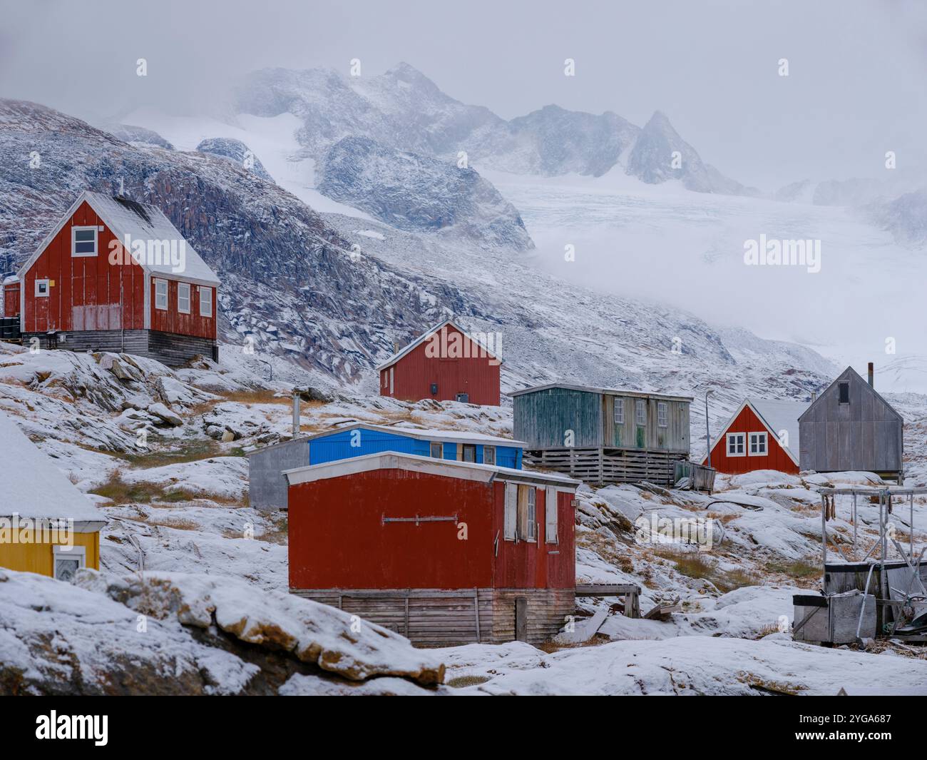 Little Inuit village Tinit (Tiilerilaaq) at the shore of the Sermilik ...