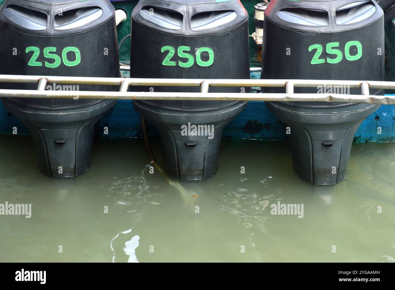 Three powerful engines mounted on the speedboat Stock Photo - Alamy