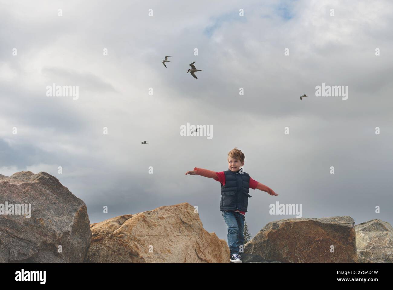 Child pretending to be a bird hi-res stock photography and images - Alamy