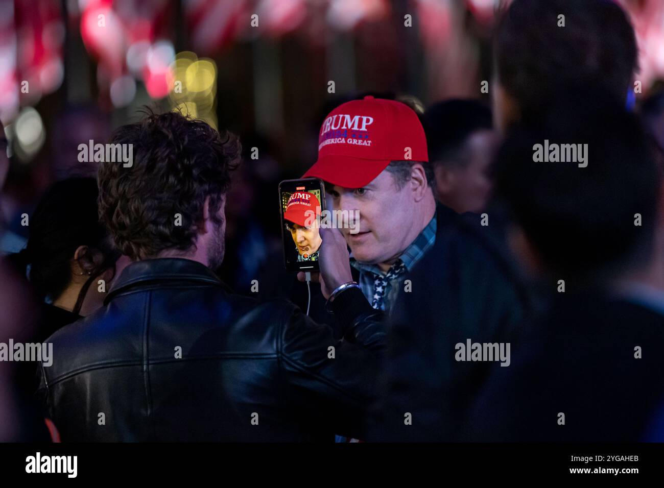 Onlookers watch as the 2024 U.S. Presidential election results are ...