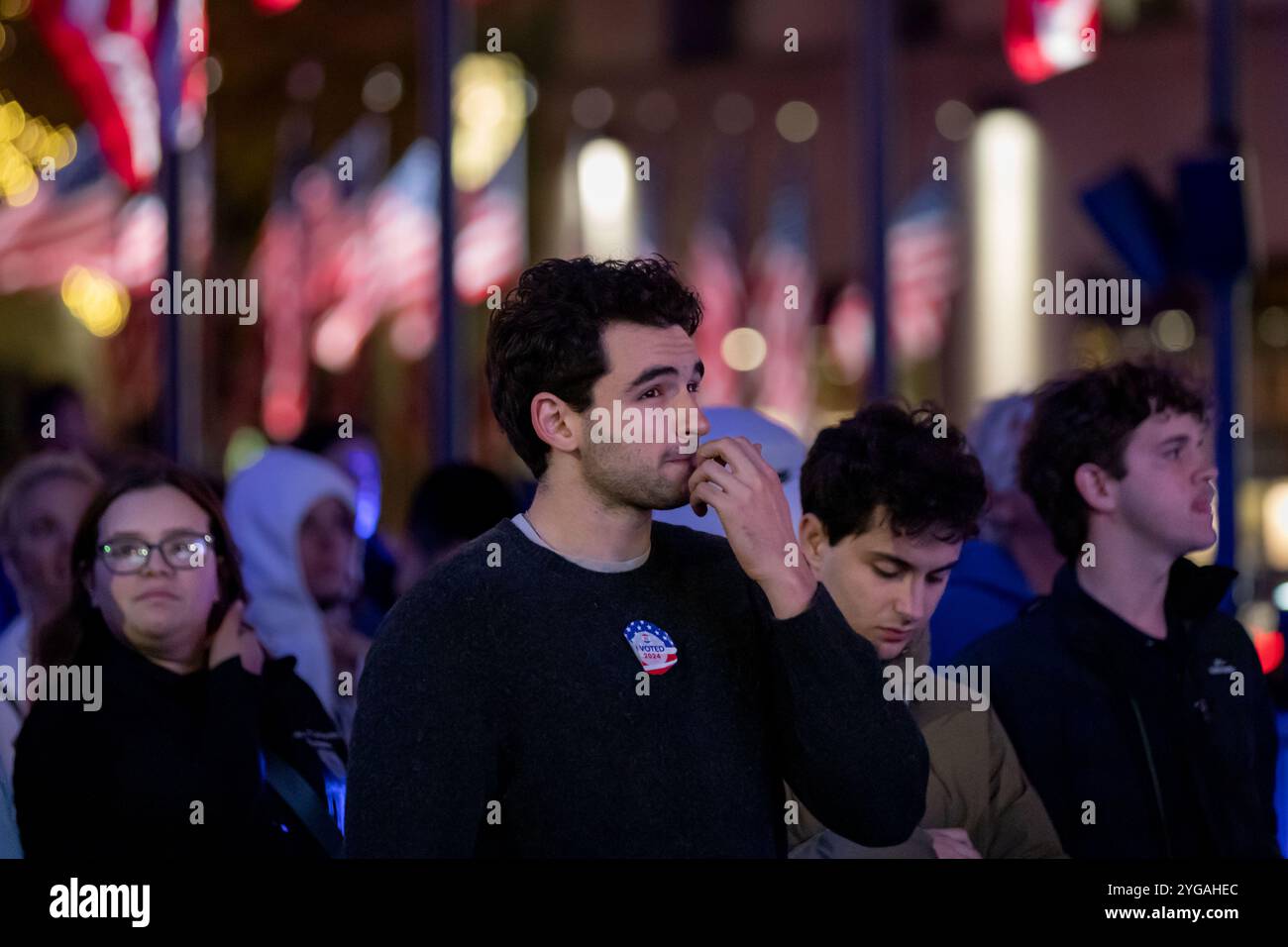 Onlookers watch as the 2024 U.S. Presidential election results are ...